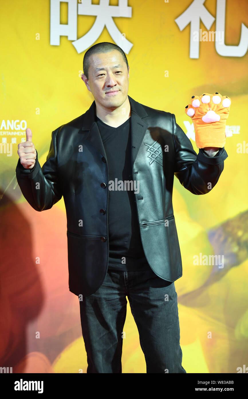 Chinese director Ding Sheng arrives on the red carpet for the premiere ...