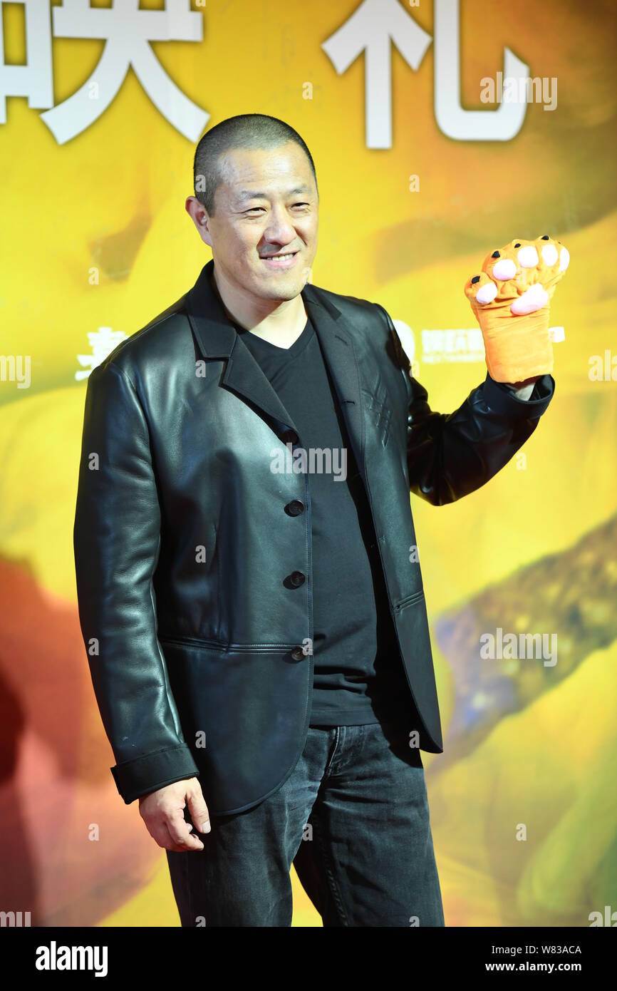 Chinese director Ding Sheng arrives on the red carpet for the premiere ...