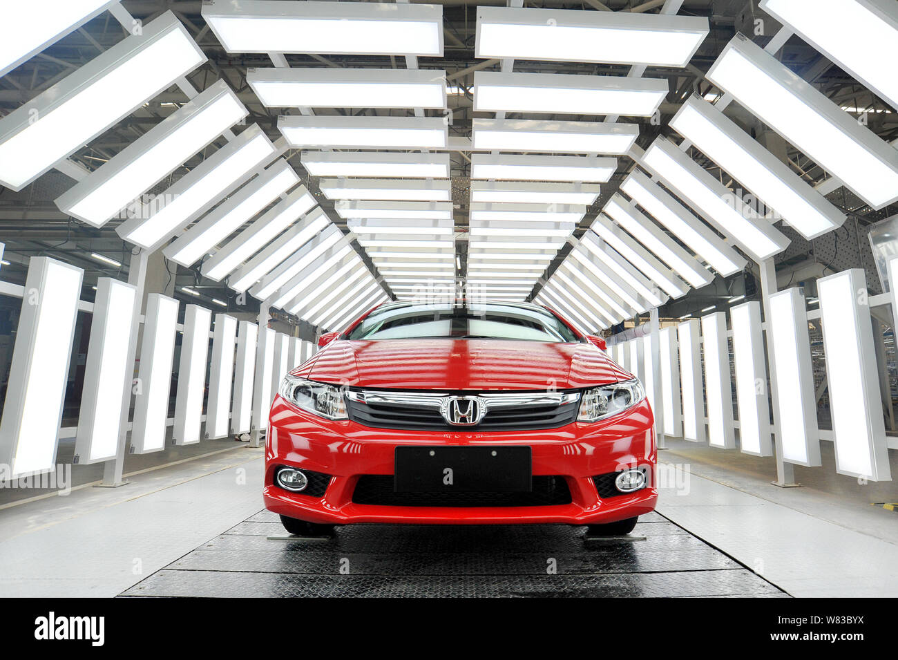 --FILE--A car is being manufactured on the assembly line at an auto ...