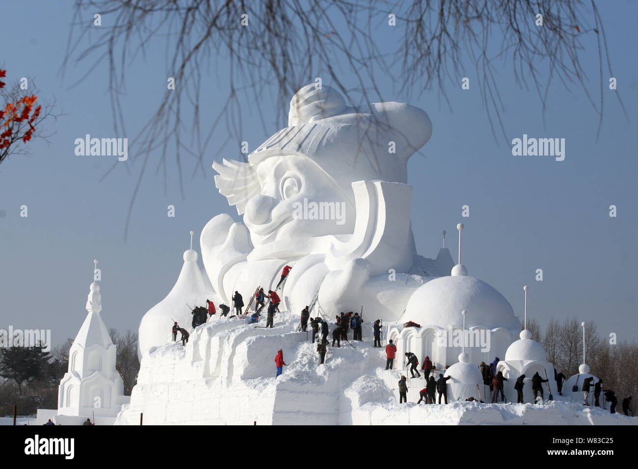 Chinese workers sculpt a 34-meter-tall snowman in preparation for the ...