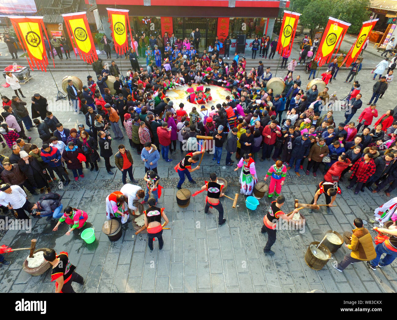 Chinese people of Tujia ethnic minority pound doughs divided from the ...
