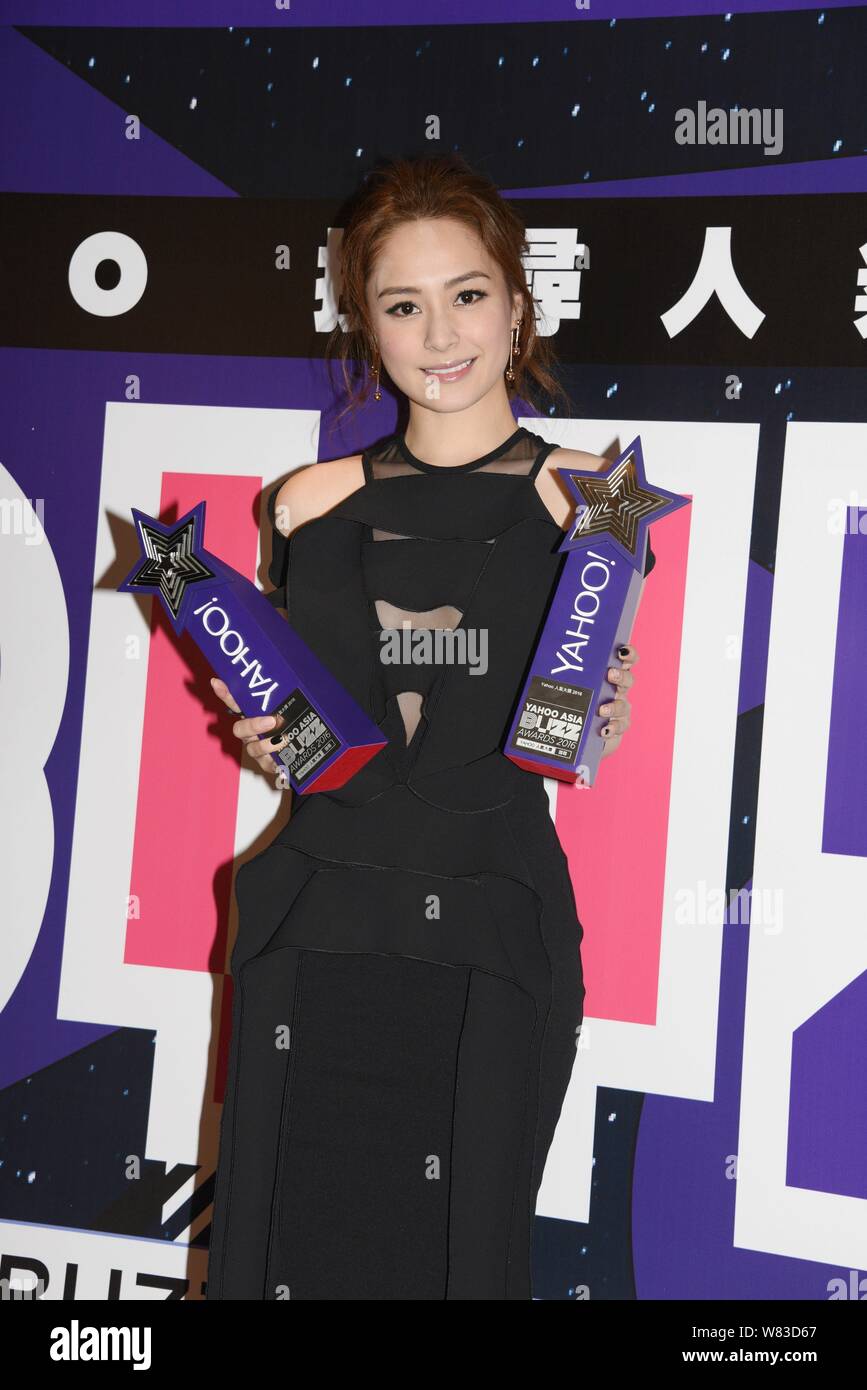 Singer and actress Gillian Chung of Hong Kong pop duo Twins poses with her trophies during the ...