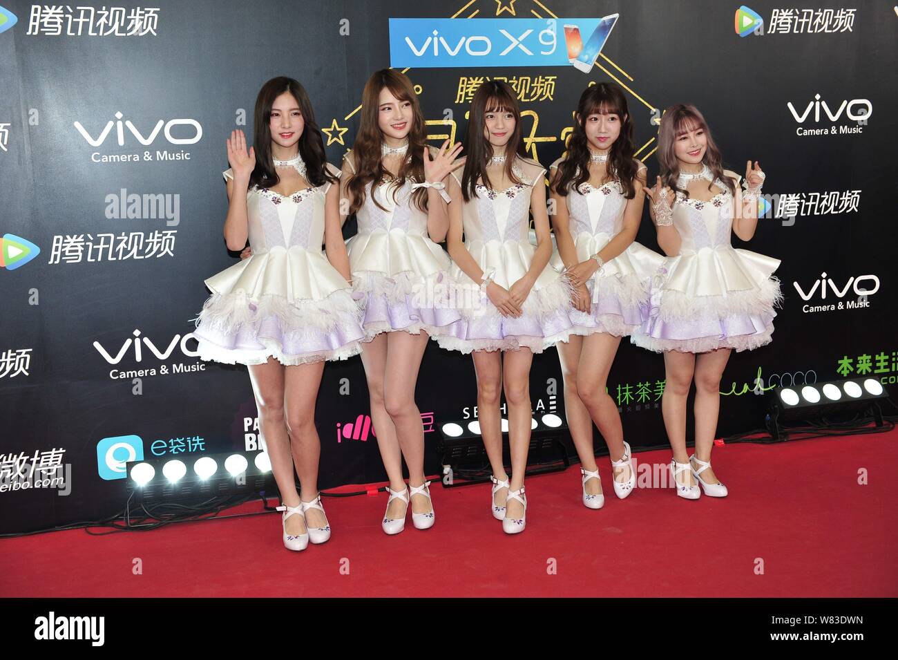 Members of Chinese girl group SNH48 arrive on the red carpet for the ...