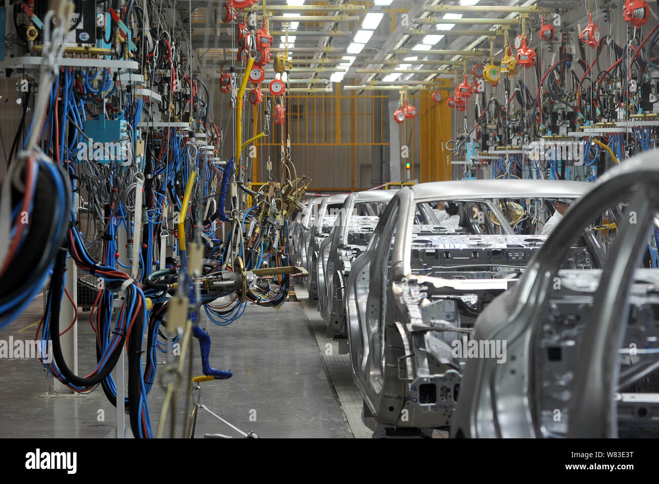 --FILE--Cars are being manufactured on the assembly line at an auto ...