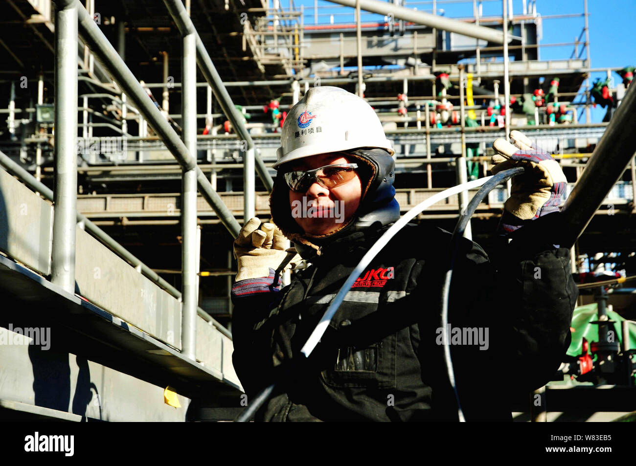 --FILE--A Chinese employee of CNOOC (China National Offshore Oil ...