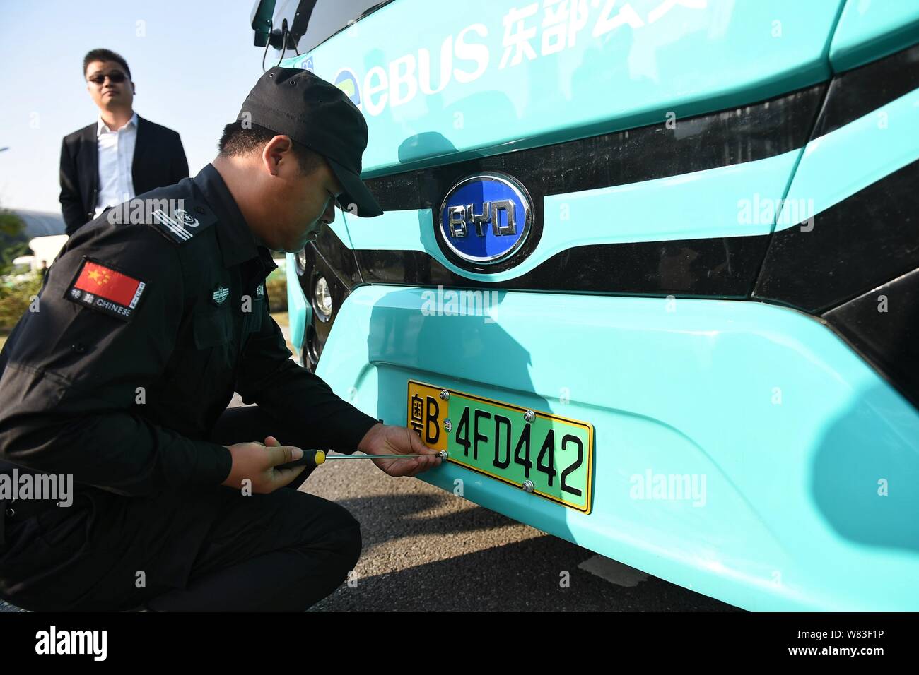 A Chinese employee of the local vehicle administration department ...