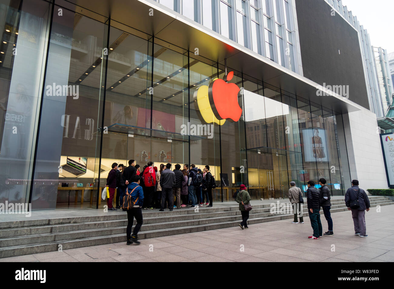 The logo of Apple Inc. is illuminated with red light to mark the World ...