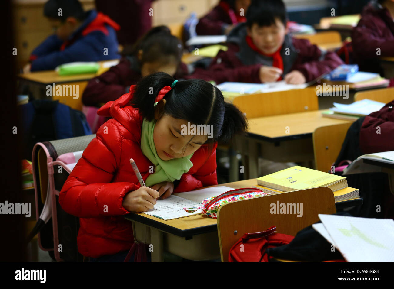 --FILE--Young Chinese students study in a classroom in a primary school ...