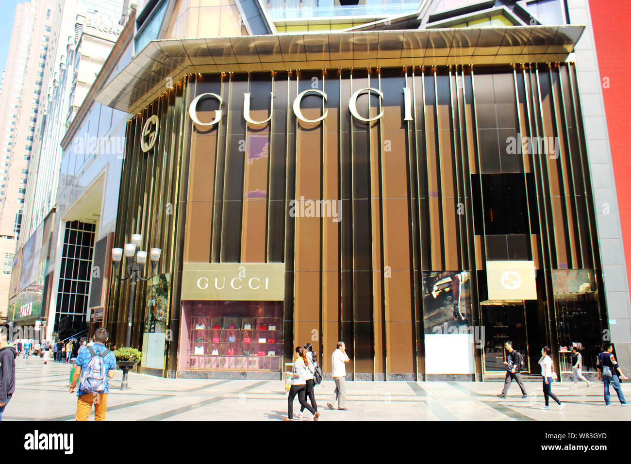 --FILE--Pedestrians walk a Gucci boutique at a shopping mall in ...