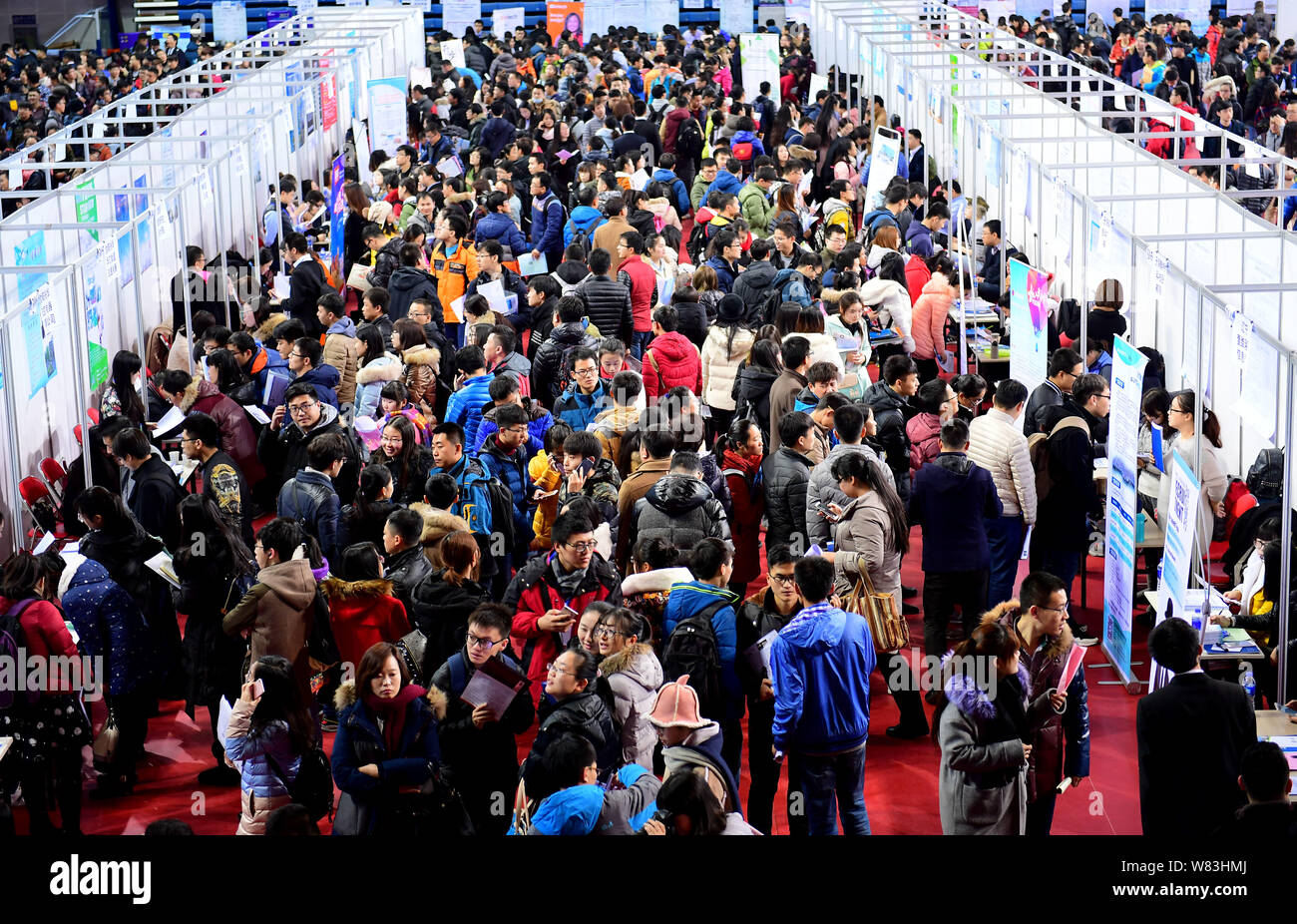 --FILE--Chinese graduates crowd booths to seek for employments during a ...
