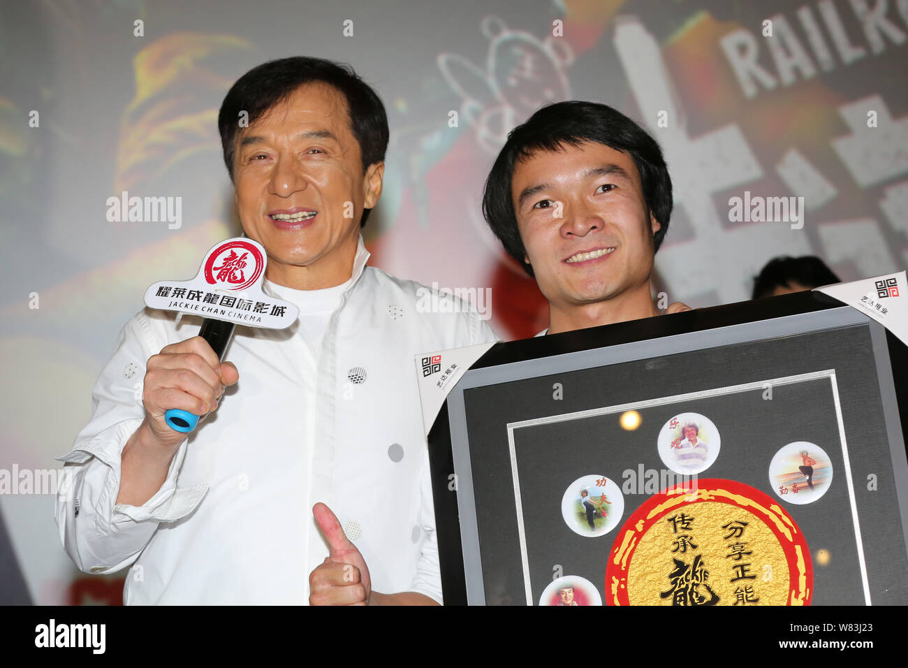 Hong Kong kungfu superstar Jackie Chan, left, attends a promotional ...