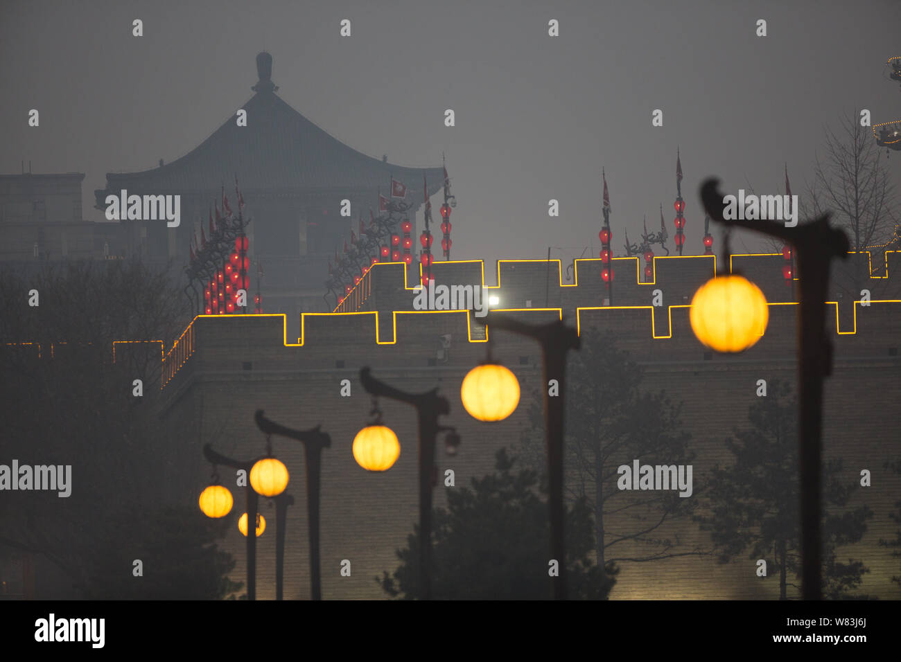 The ancient Xi'an Bell Tower is seen vaguely in Xi'an city, northwest ...