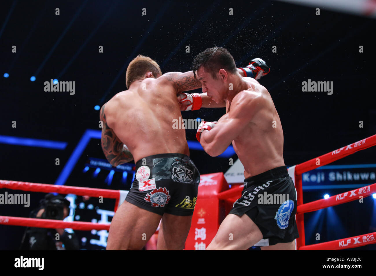 Wang Sai of China, right, fights against Koji Shikuwa of Japan during ...