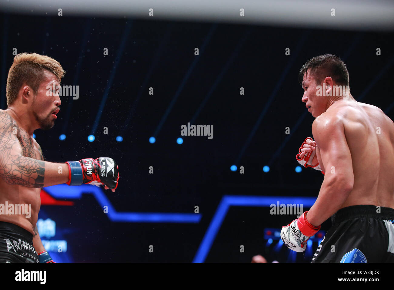Wang Sai of China, right, fights against Koji Shikuwa of Japan during ...