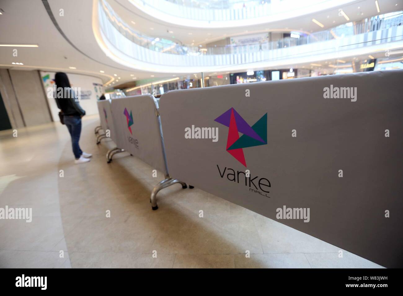 --FILE--Logos of Vanke are pictured at Vanke Mall in Qibao town ...