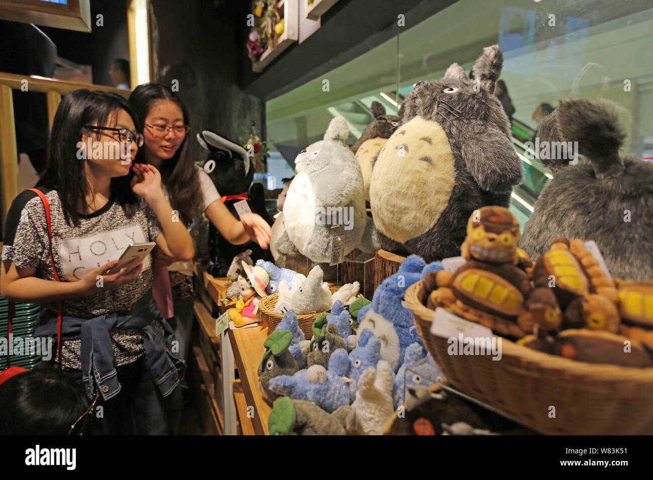 Chinese fans shop for peripheral products at a franchised store of ...