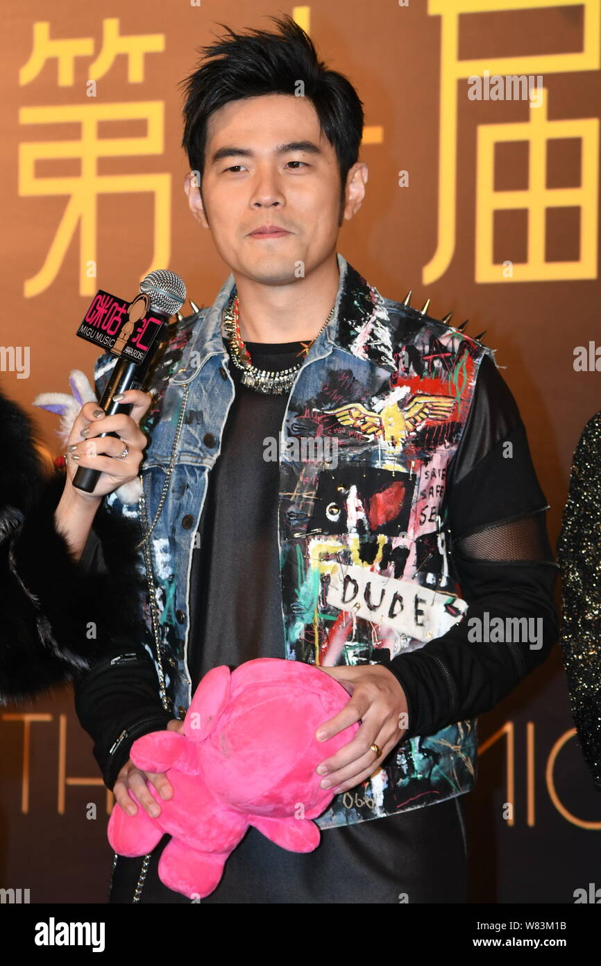 Taiwanese singer Jay Chou arrives on the red carpet for the 10th Migu ...