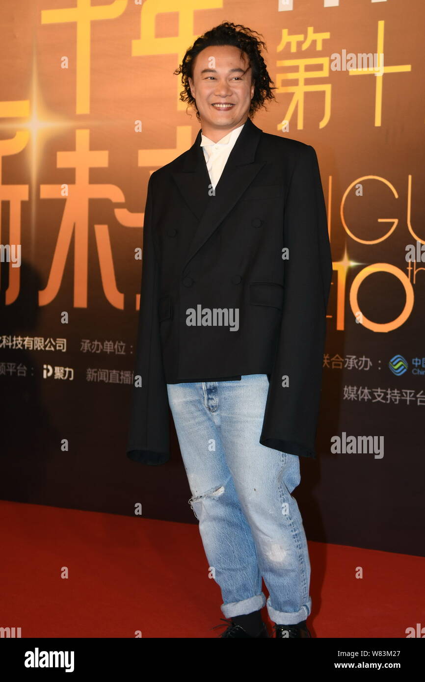 Hong Kong singer Eason Chan arrives on the red carpet for the 10th Migu ...