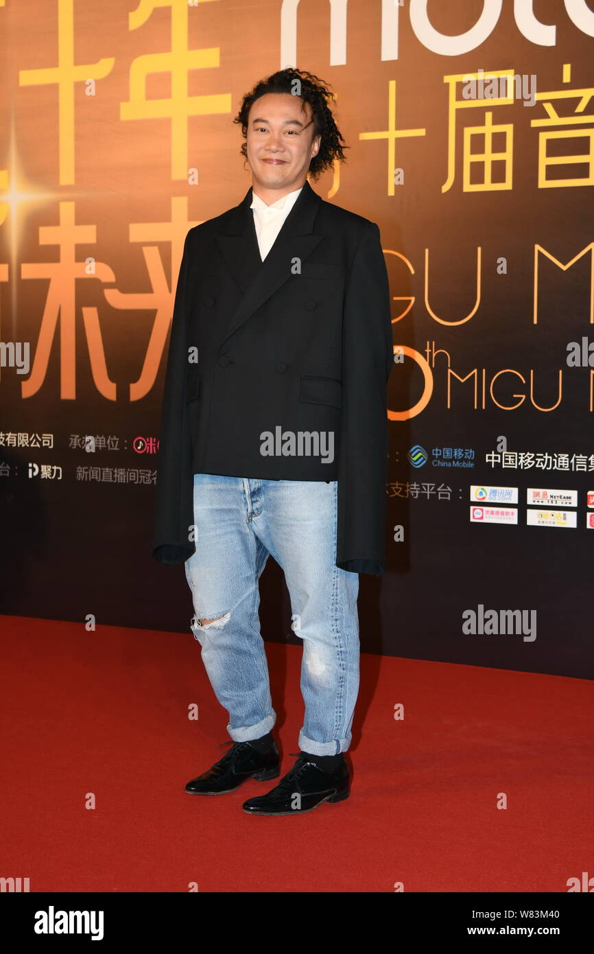 Hong Kong singer Eason Chan arrives on the red carpet for the 10th Migu ...