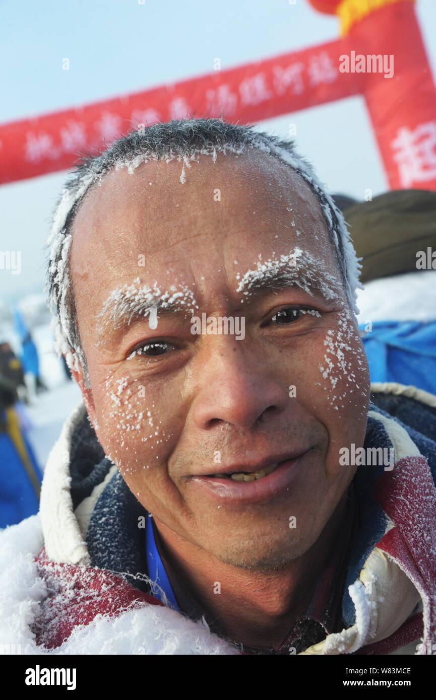 Ice, snow and frost are seen on the hair, eyebrows and eyelashes of a ...