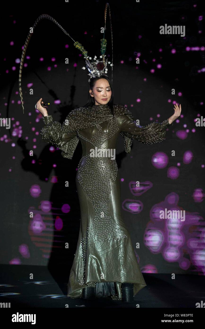Chinese singer-songwriter Sa Dingding performs at a press conference to ...