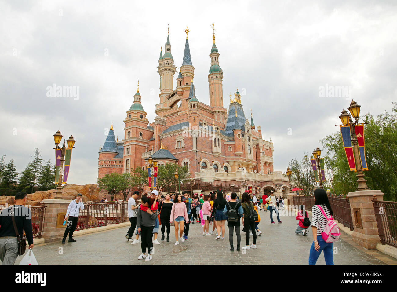 --FILE--Tourists visit the Disney Castle in the Shanghai Disneyland at ...