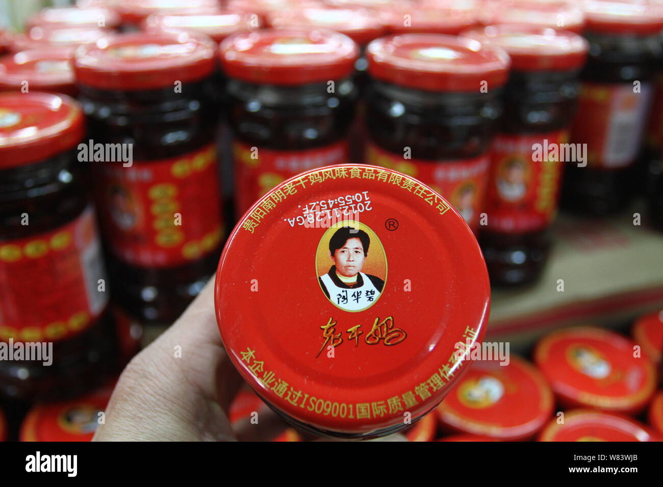 --FILE--A shopper buys a bottle of Lao Gan Ma or Laoganma chili sauce ...