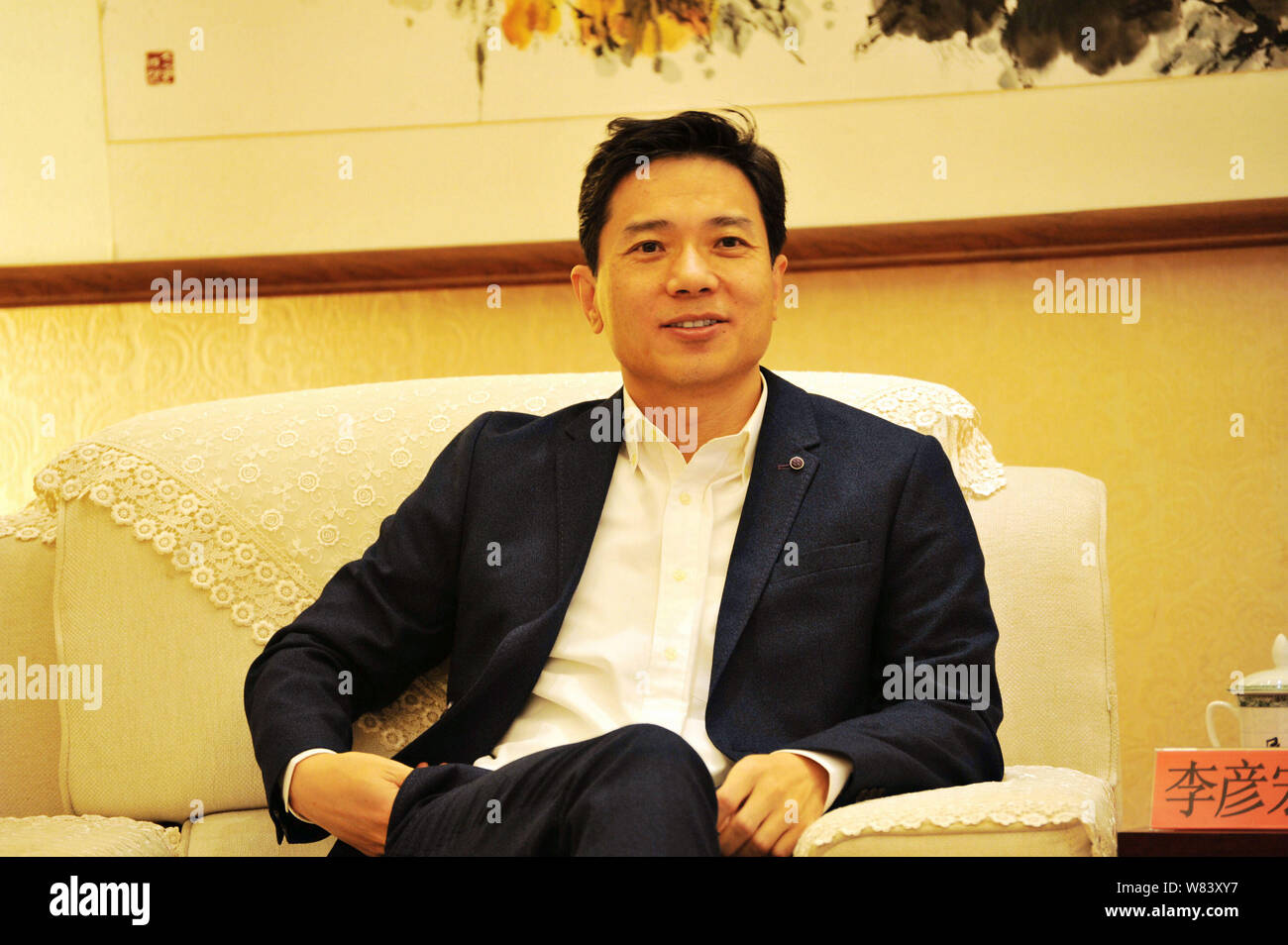 Robin Li Yanhong, Chairman and CEO of Baidu, attends a signing ceremony ...