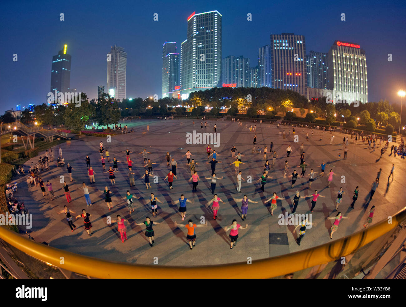 --FILE--Local Chinese women dance on a square in the evening in Huaian ...