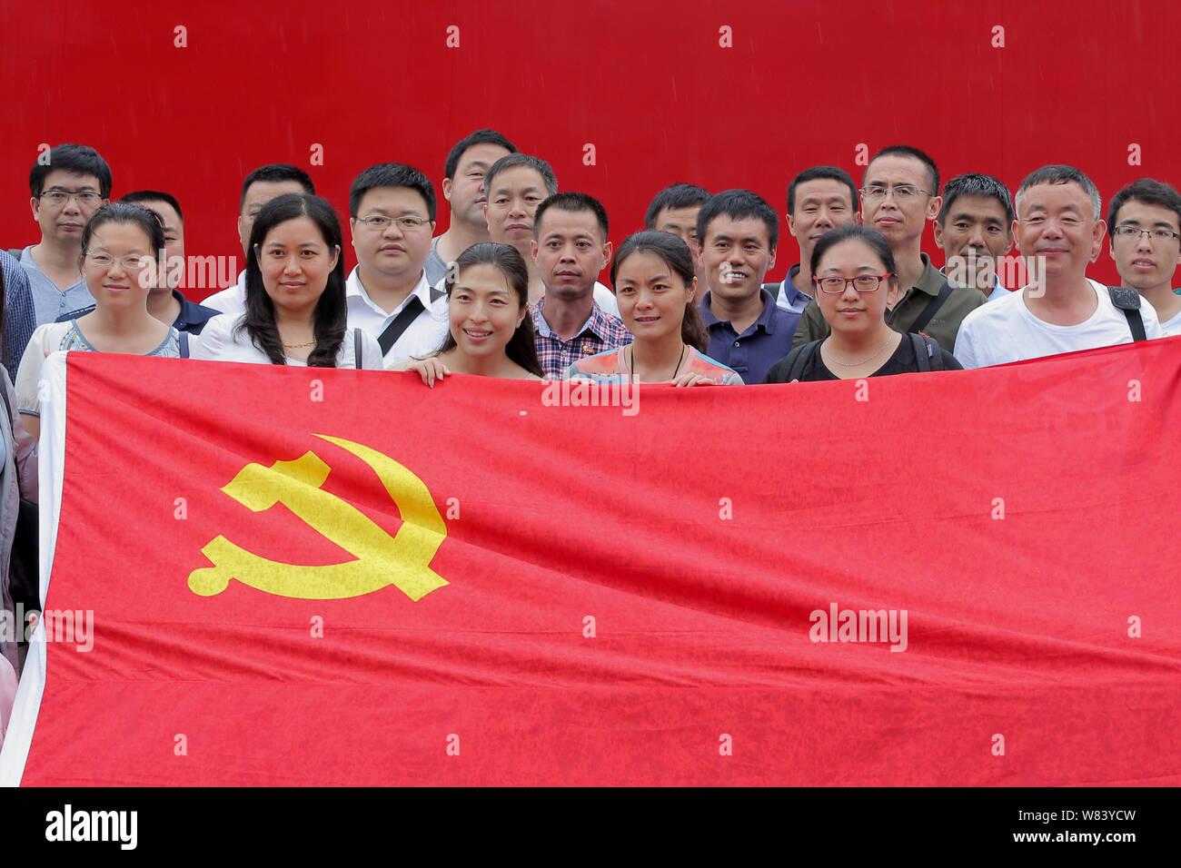 --FILE--Chinese members of the Communist Party of China (CPC) pose with ...