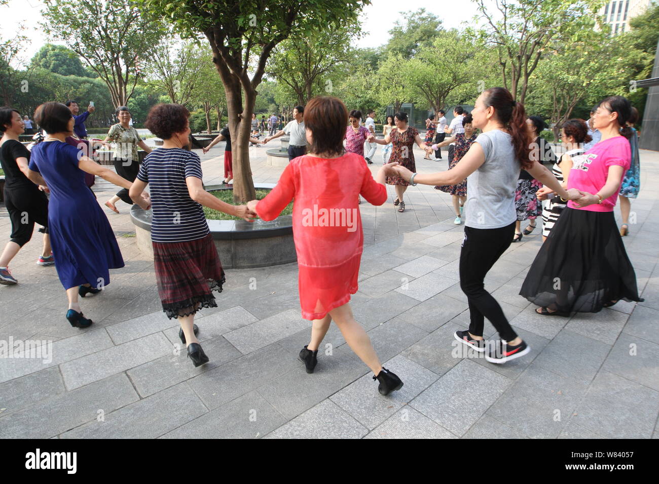 --FILE--Local Chinese women dance in a park in Hangzhou city, east ...