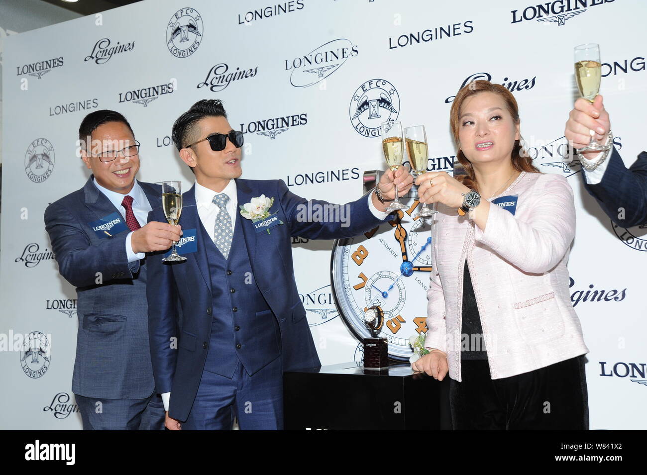Hong Kong singer and actor Aaron Kwok, center, attends a promotional ...
