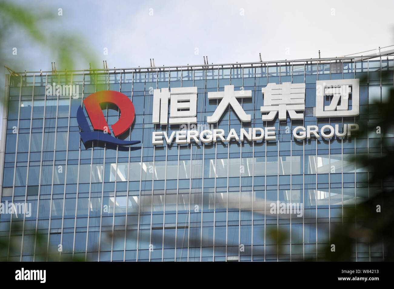 --FILE--View of a logo of Evergrande Group on a high-rise office ...