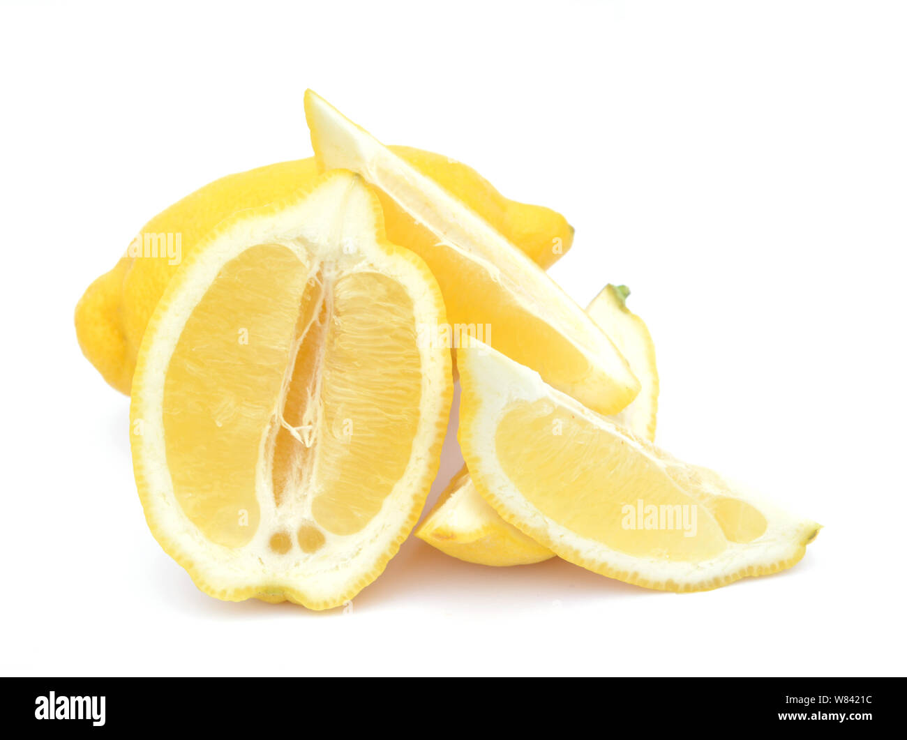 Whole and chopped lemon on white Stock Photo - Alamy