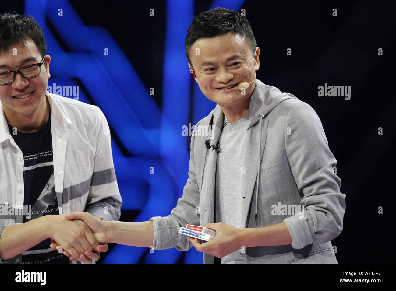 Jack Ma or Ma Yun, right, Chairman of Alibaba Group, performs a magic ...