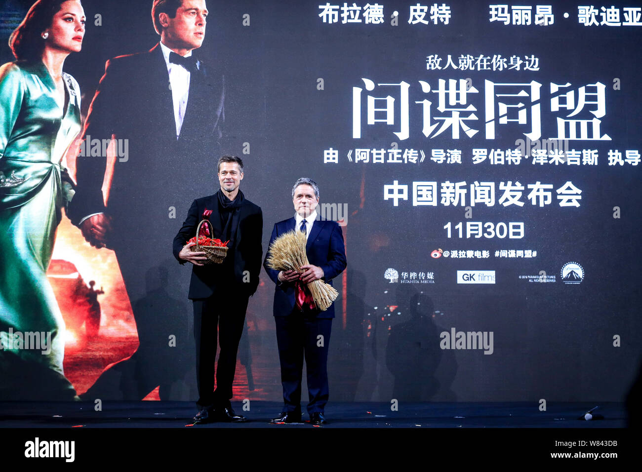 American actor Brad Pitt, left, attends a press conference for his new ...