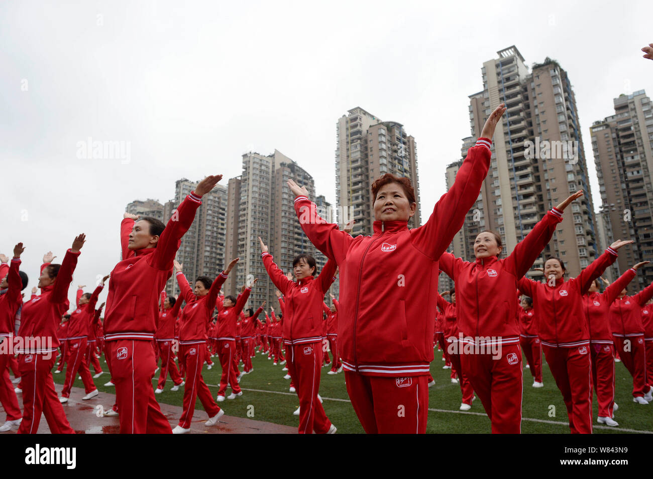 Local Chinese residents perform square dance during an attempt to set a ...
