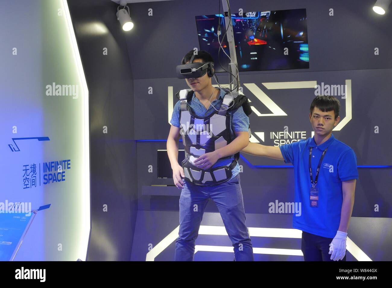 A visitor tries out a virtual reality (VR) device during the 14th China ...