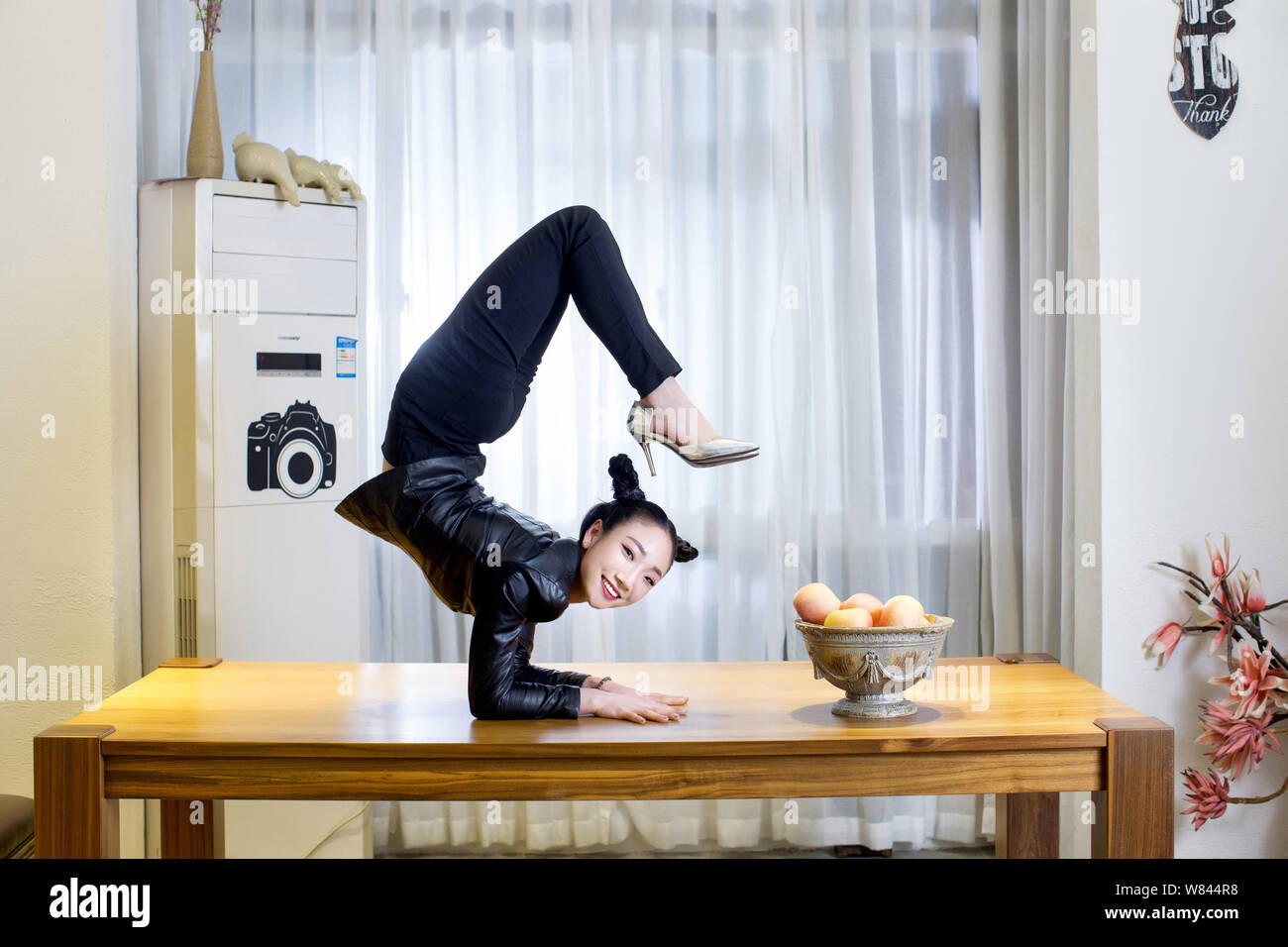 Chinese contortionist Liu Teng shows the flexibility of her body in an ...