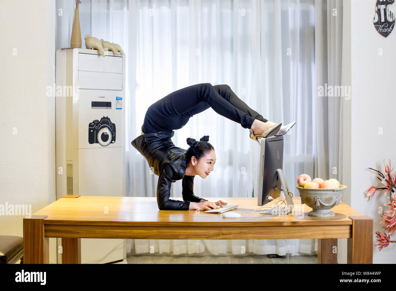 Chinese contortionist Liu Teng shows the flexibility of her body in an ...