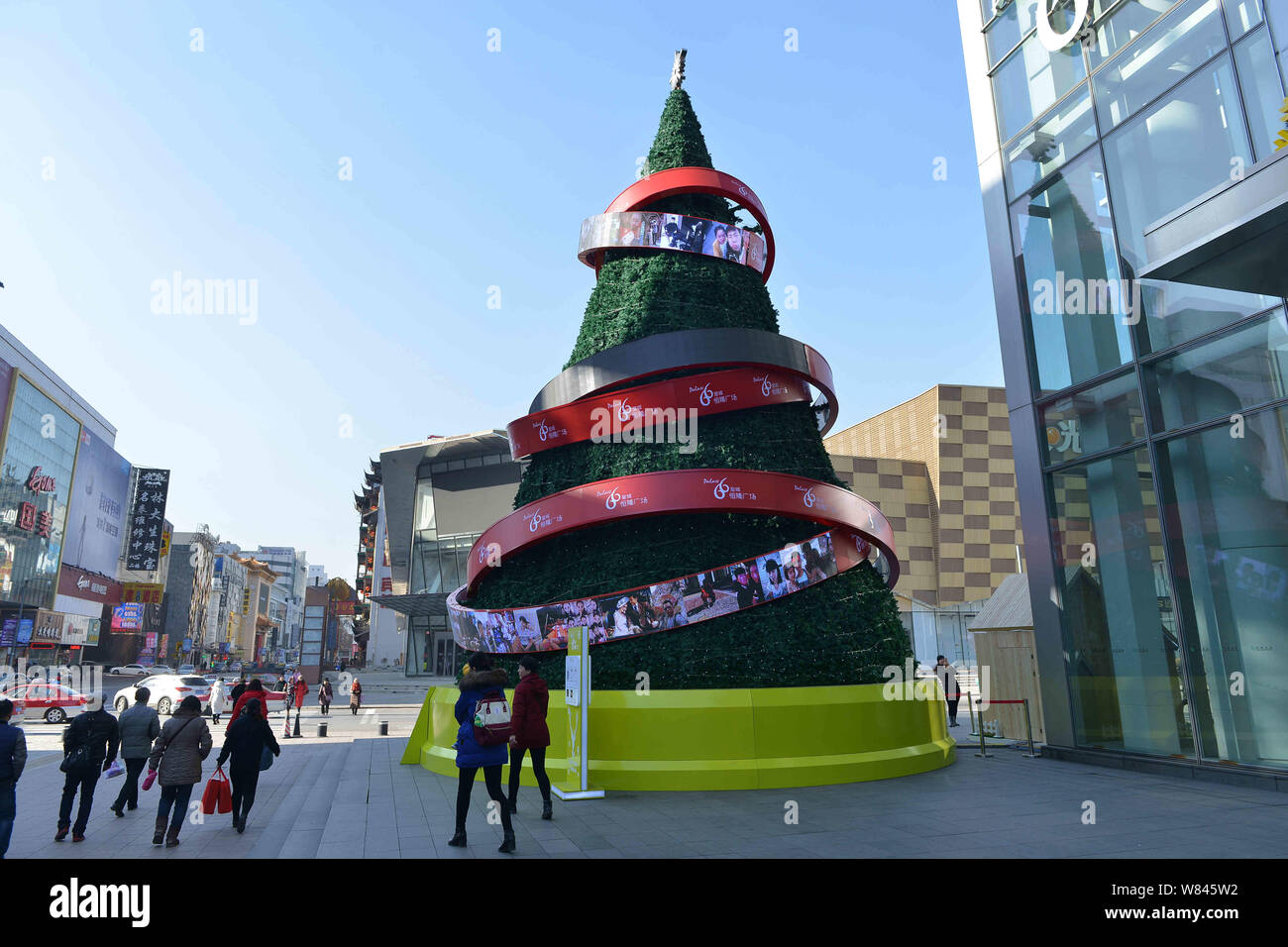 A giant Christmas tree is displayed outside a shopping mall in Shenyang ...