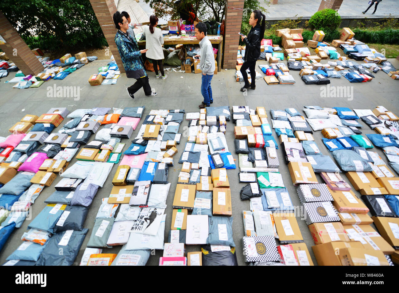 Chinese students look for their own parcels amongst many packages, most ...