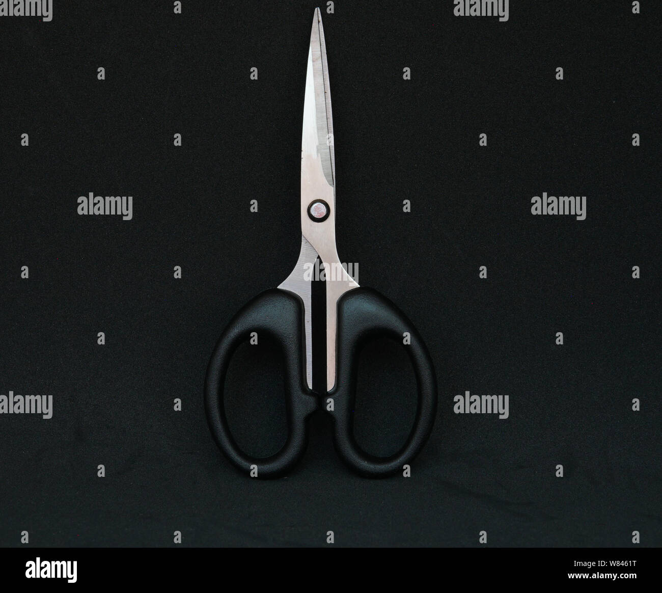 scissor in black background Stock Photo - Alamy