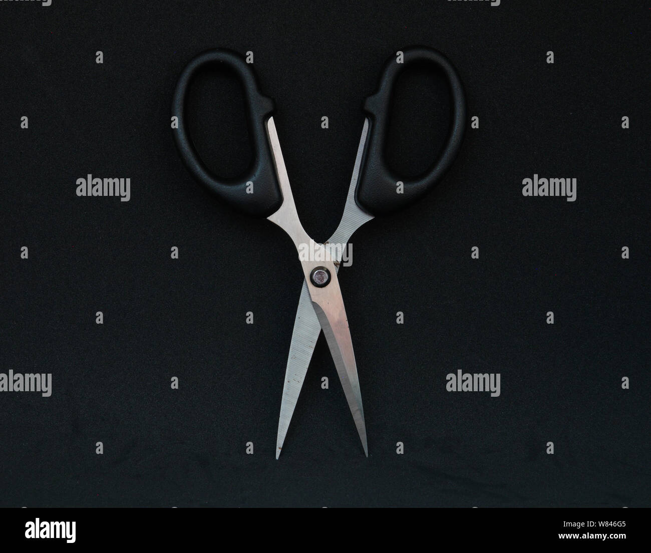scissor in black background Stock Photo - Alamy