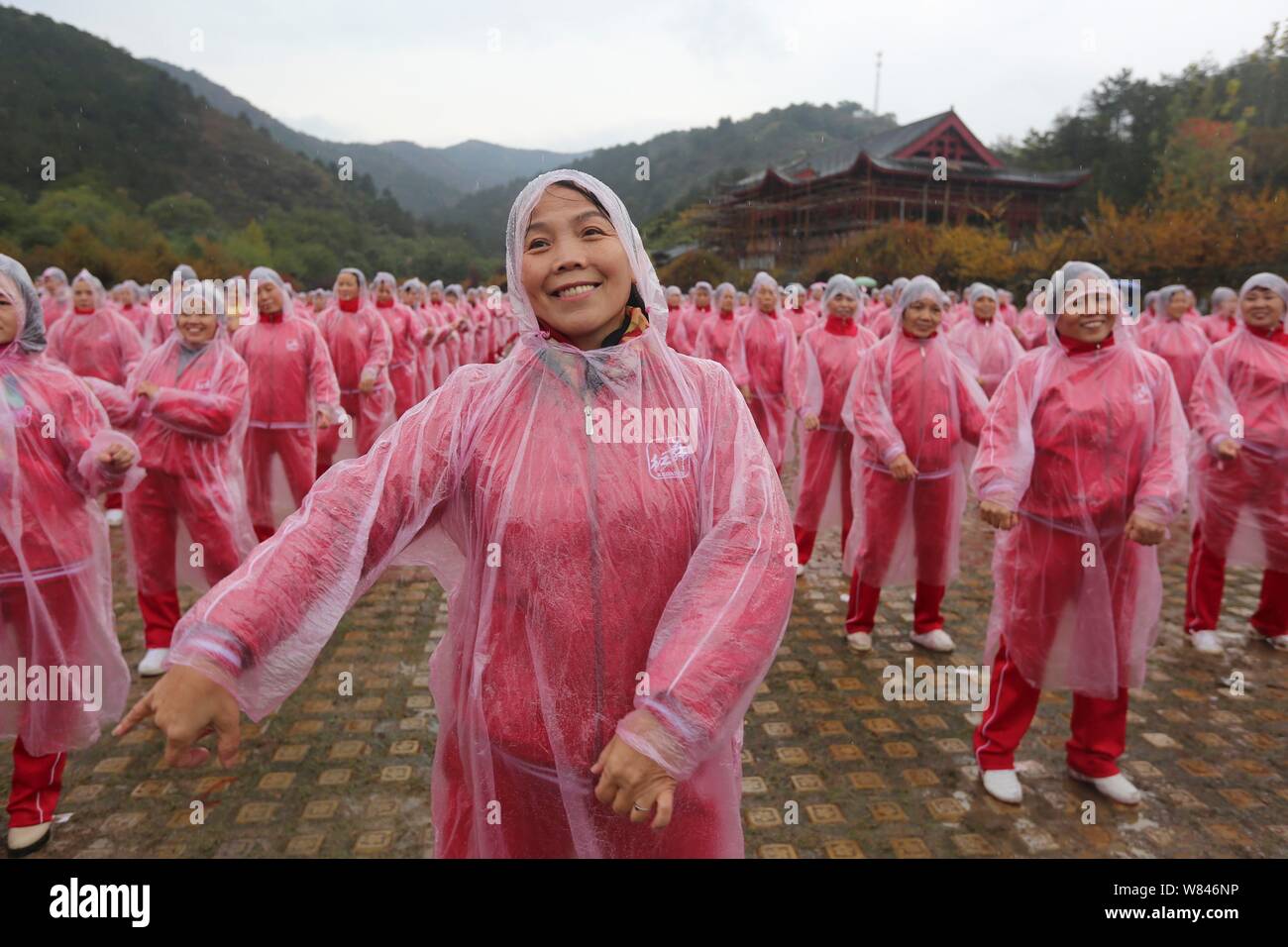 Wearing raincoats hi-res stock photography and images - Alamy