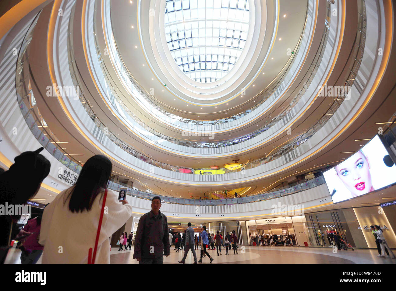 People are shopping at Vanke Mall in Qibao town, Shanghai, China, 2 ...