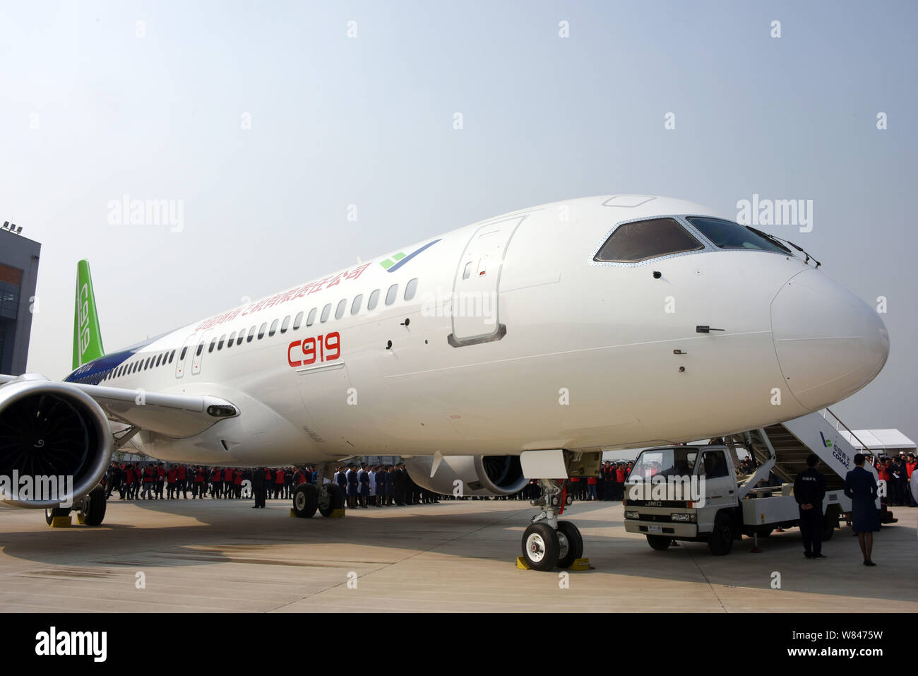 --FILE--People look at China's first homemade large passenger jet C919 ...