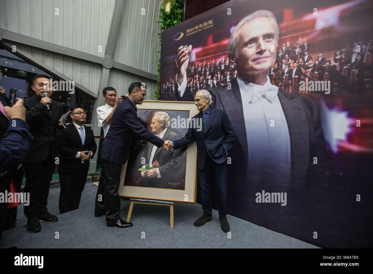 Spanish tenor Jose Carreras, right, shakes hands with a donor of a ...