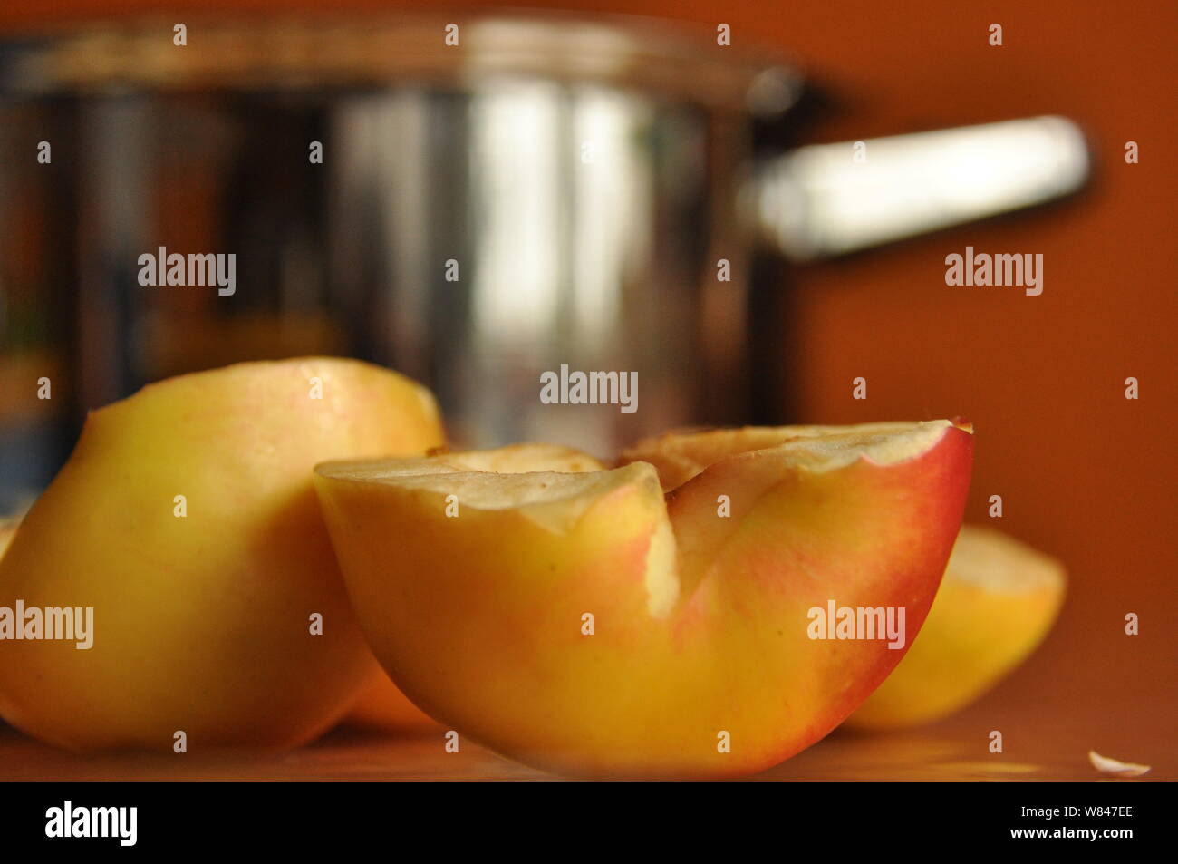 Sliced apples compote. Pot for preparing a beverage Stock Photo - Alamy