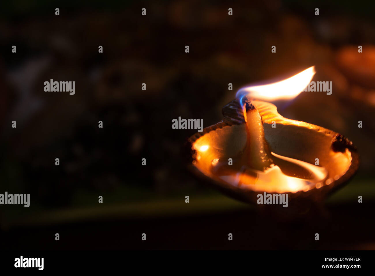 Lamps lit during the prayers to god along with food offering Stock ...